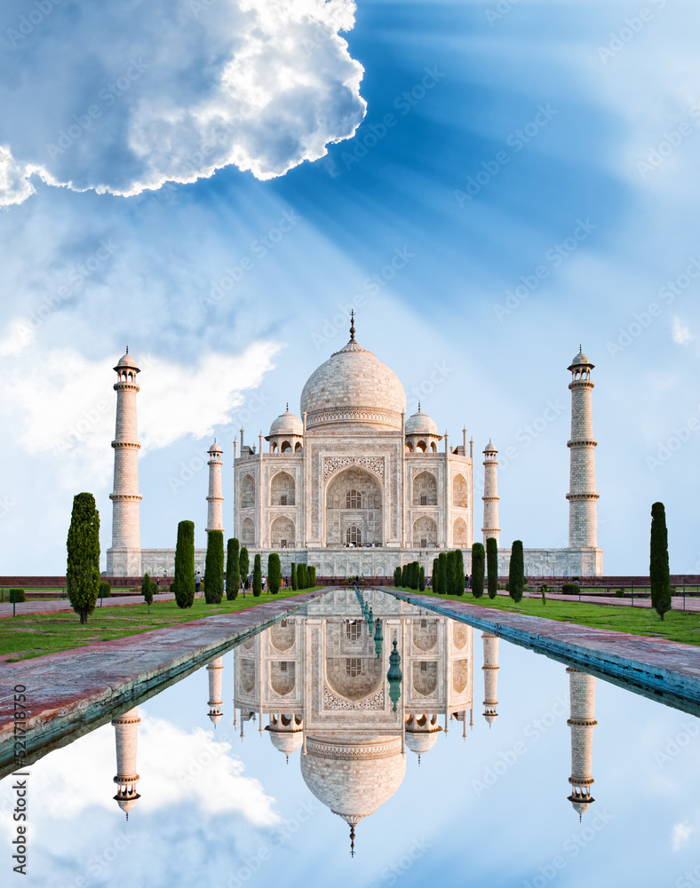 Amazing view on the Taj Mahal in sunset light with reflection in water ...