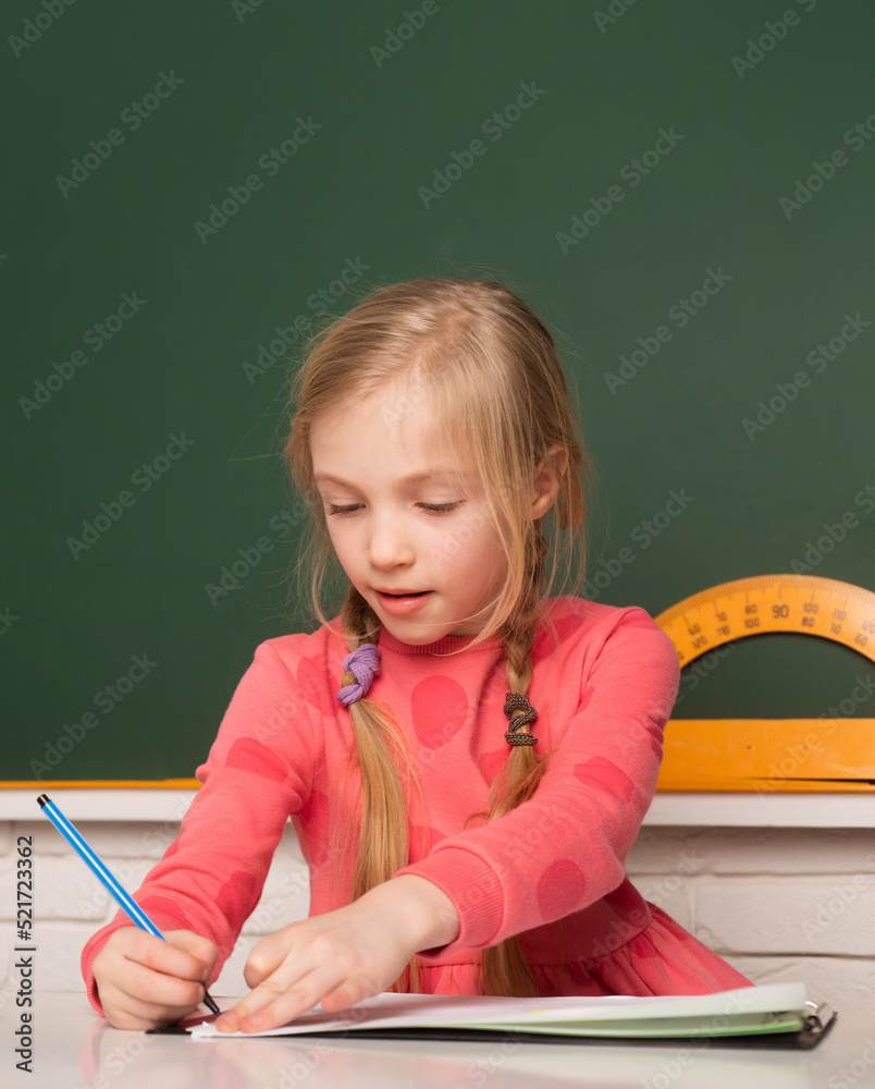 School concept. Kids drawing in notepad. Little girl pupil study in ...