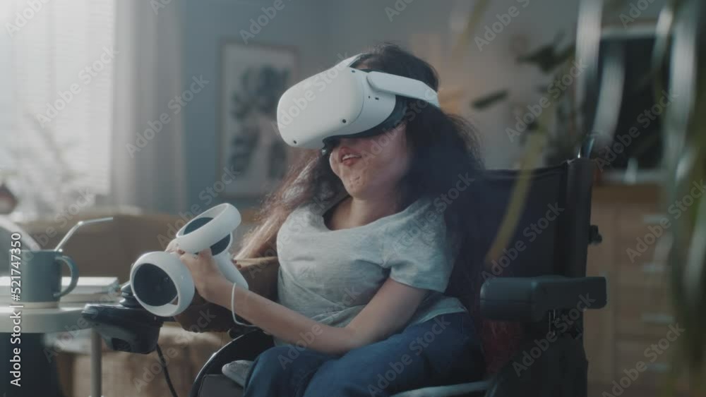 At home woman with disability in a wheelchair wearing virtual reality ...