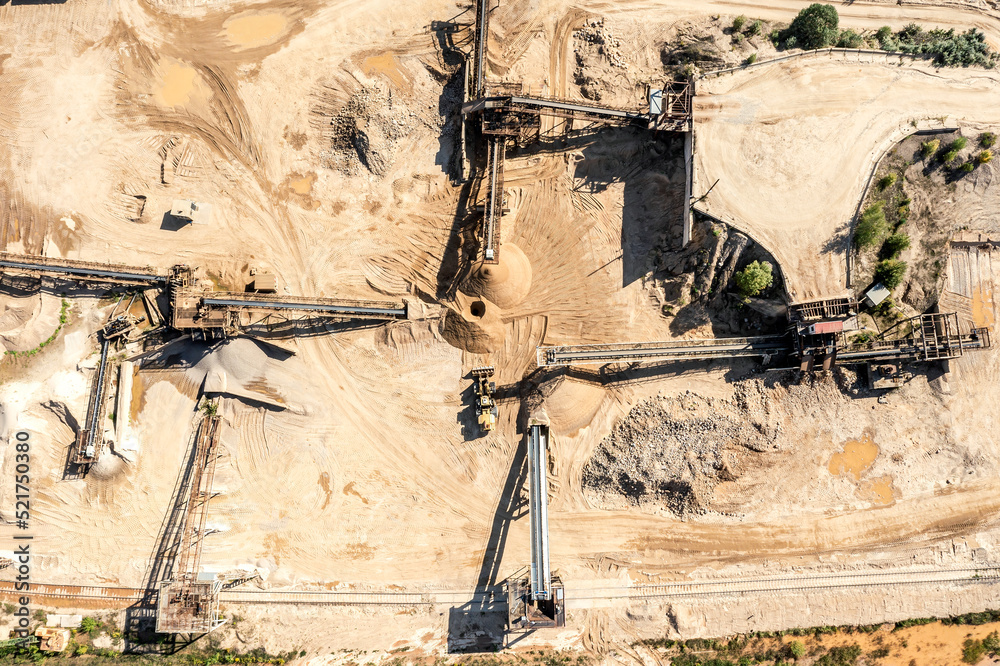 aerial top view of open sand quarry with conveyor belts. heavy ...