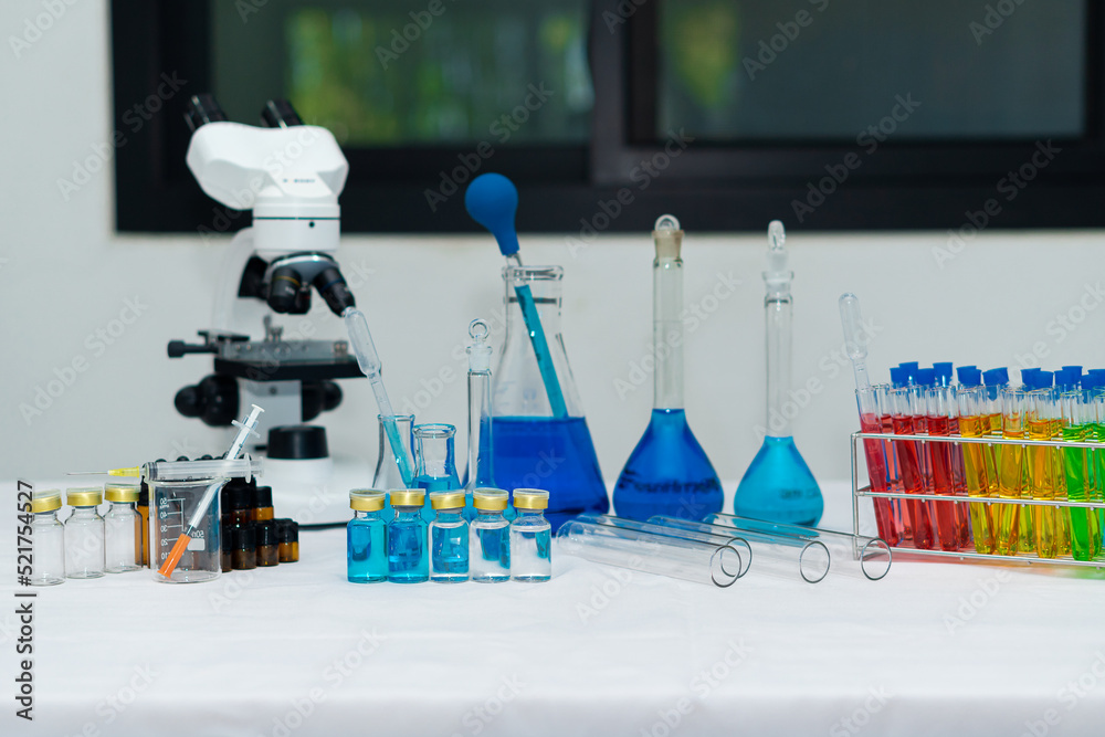 Chemistry Research Laboratory Bottles containing colored liquids and a ...