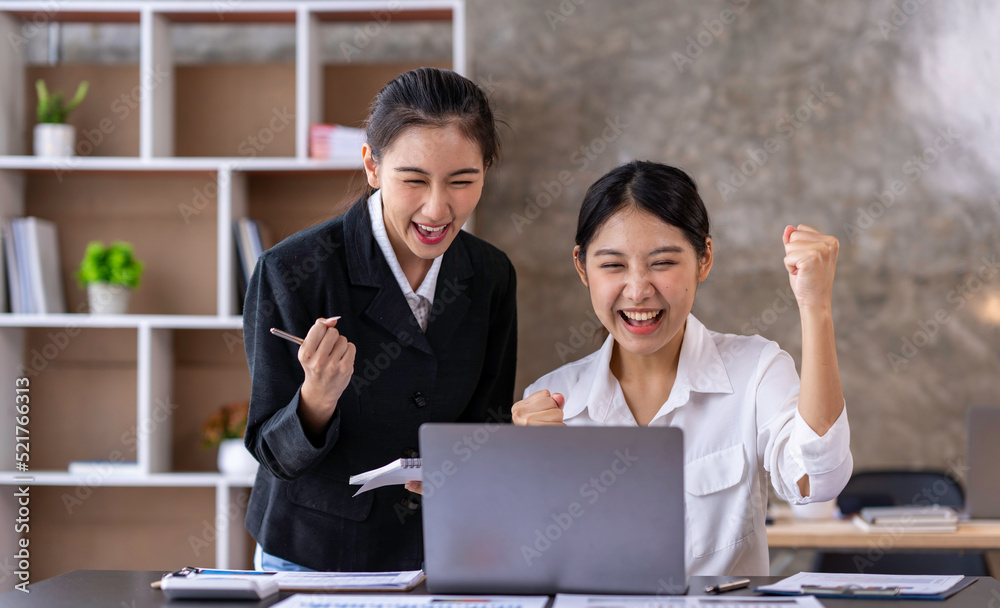 Team work process Two women are immensely rejoicing, Yes, succeeding ...