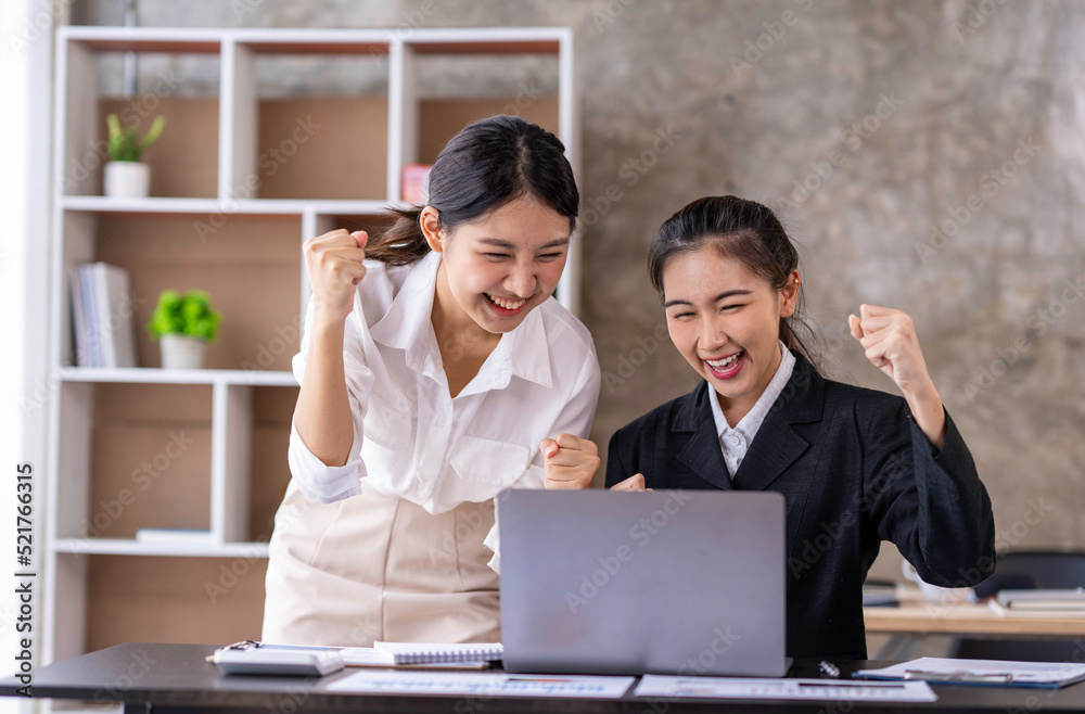 Team work process Two women are immensely rejoicing, Yes, succeeding ...
