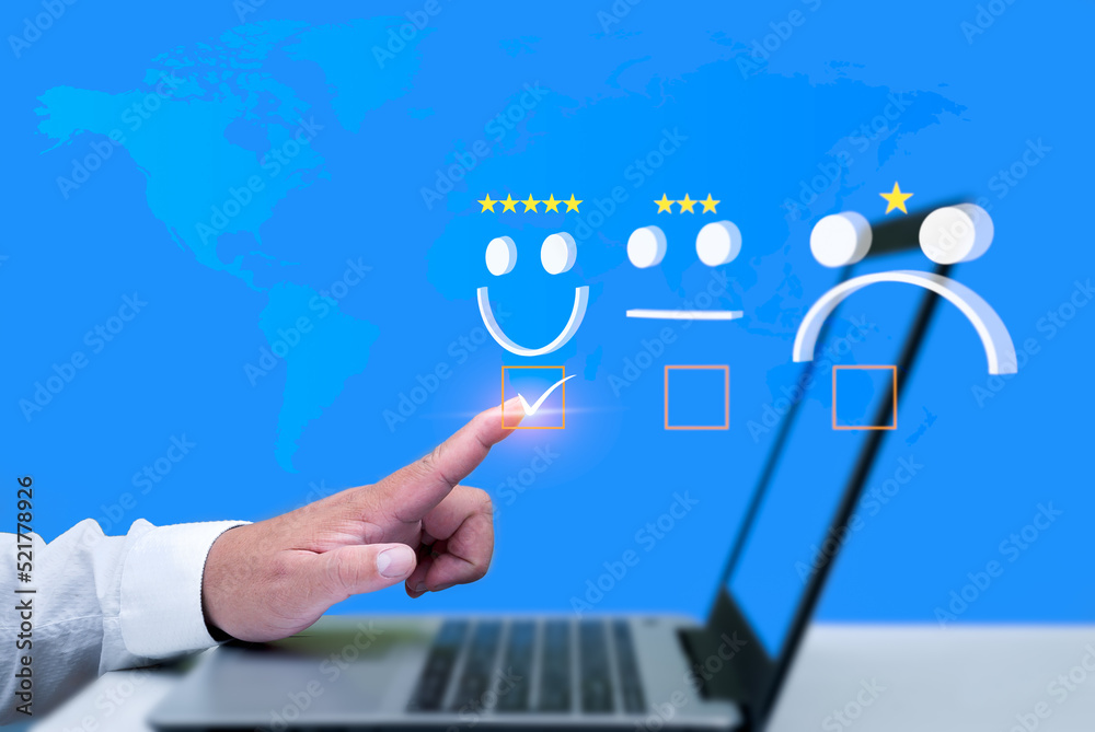 Businessman use laptop pressing smiley face emoticon on virtual touch ...