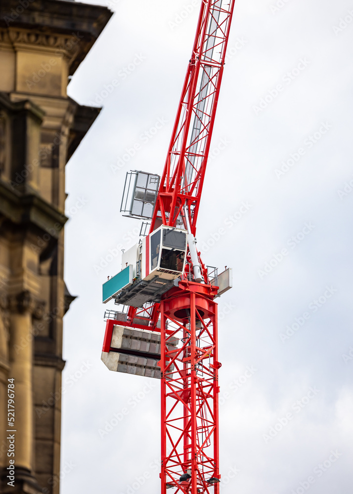 Modern city centre construction urban regeneration work. Big crane with ...