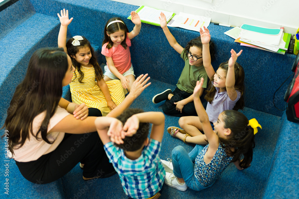 Multiracial group of children participating on a class in preschool ...