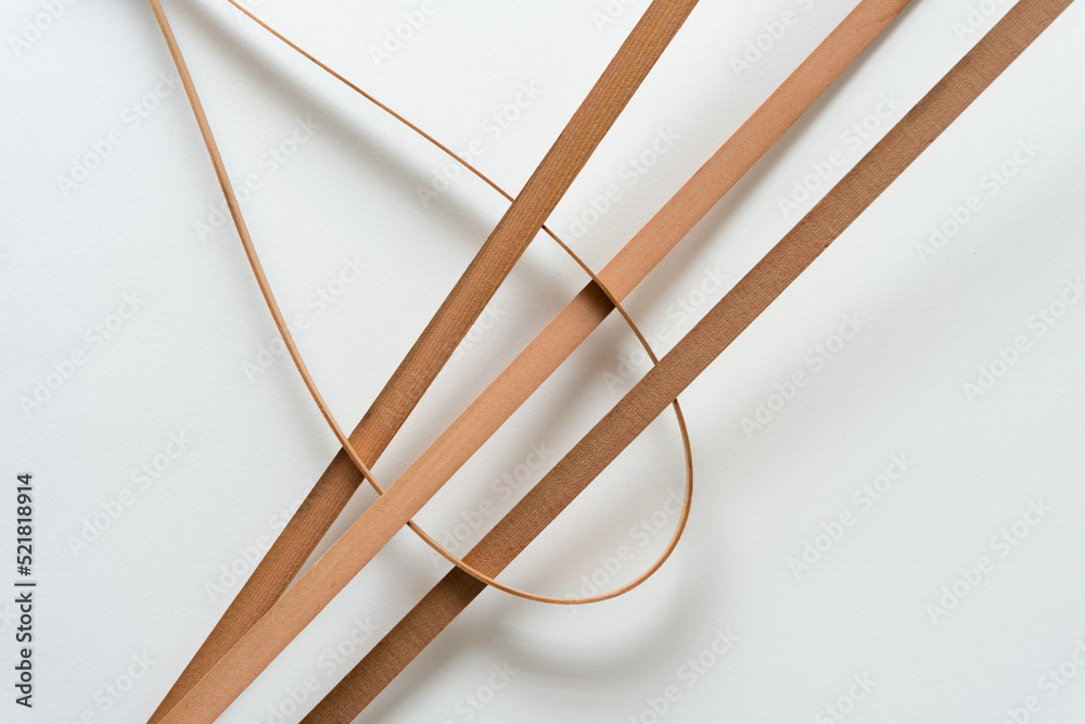 interlocked curved and straight vintage cedar wood straps on white ...