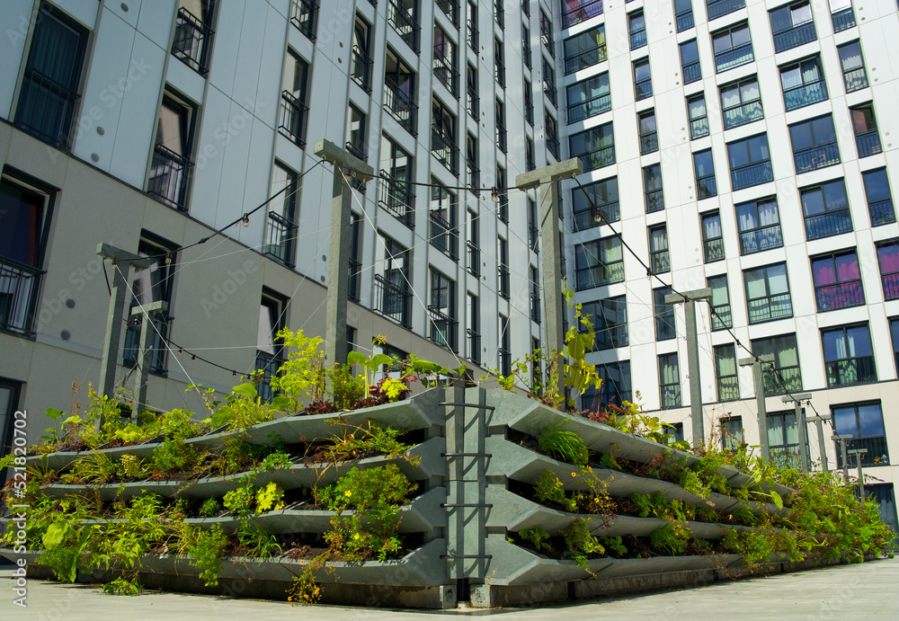 Green oasis in the city built with vertical green walls for climate ...