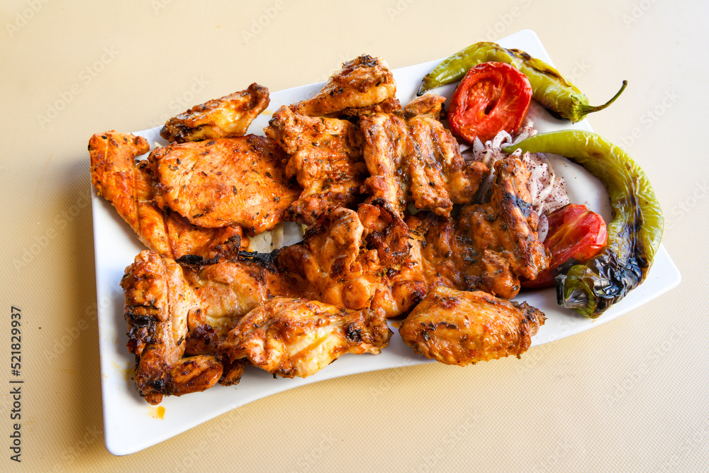 Chicken wings barbeque in a dish with BBQ grill sauce . Izgara tavuk ...