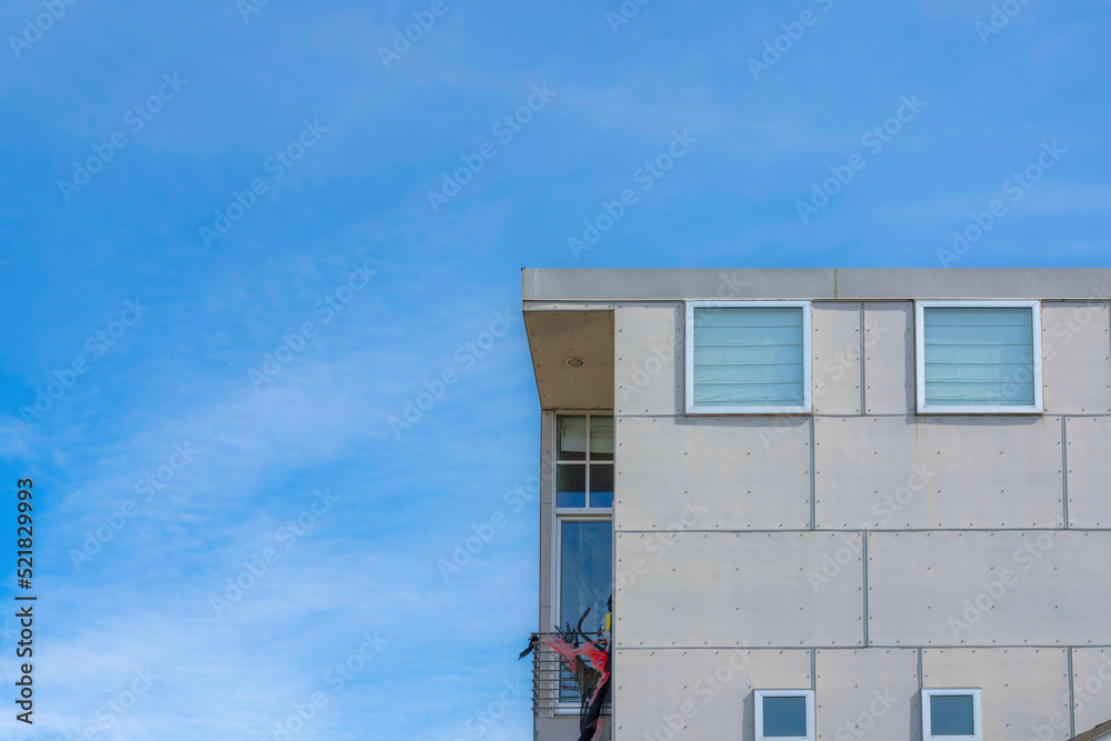 Side view of an apartment building with steel wall claddings in San ...