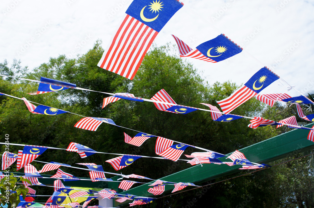 SELANGOR, MALAYSIA -AUGUST 31, 2021: Several small Malaysian flags are ...