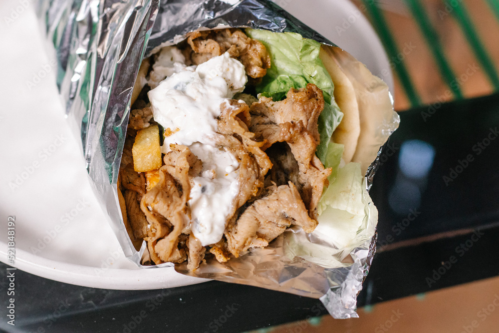 Gyro griego de cordero con tzatziki y lechuga Stock Photo | Adobe Stock