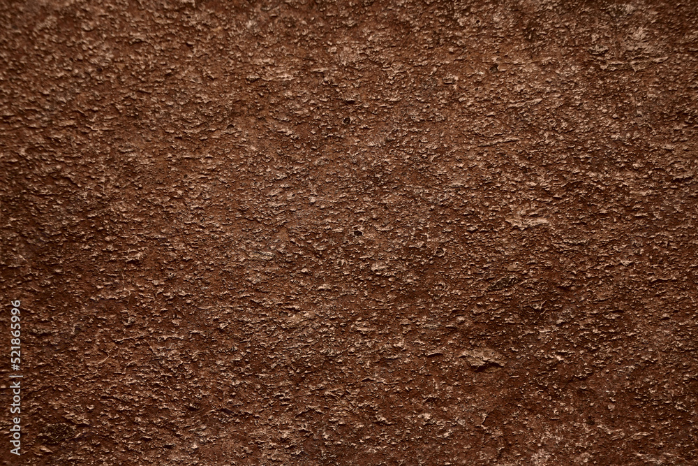 Surface of a brown dolomitic limestone breccia. Background texture of ...