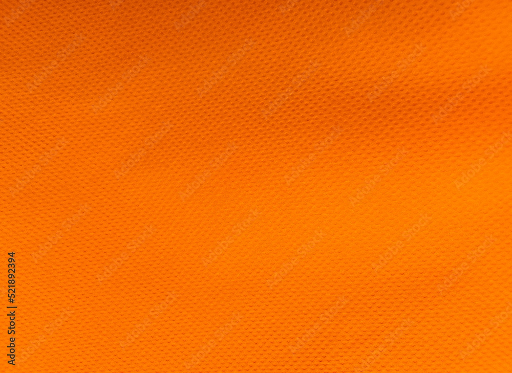 coarse porous orange color non-woven fabric surface background ...