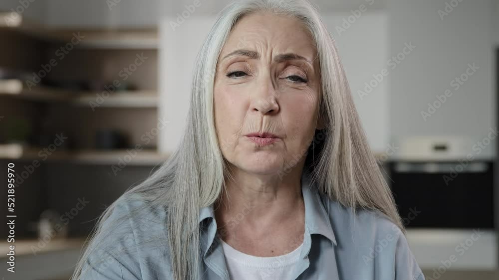 Desperate annoyed old gray-haired woman caucasian elderly lady ...