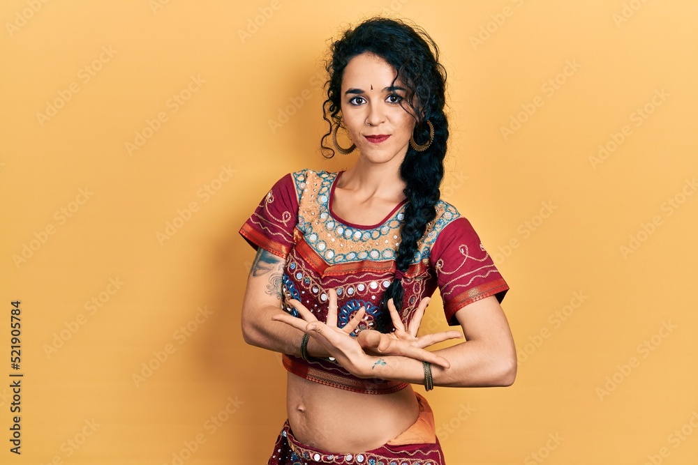 Young indian woman wearing traditional belly dancer costume. Dancing ...