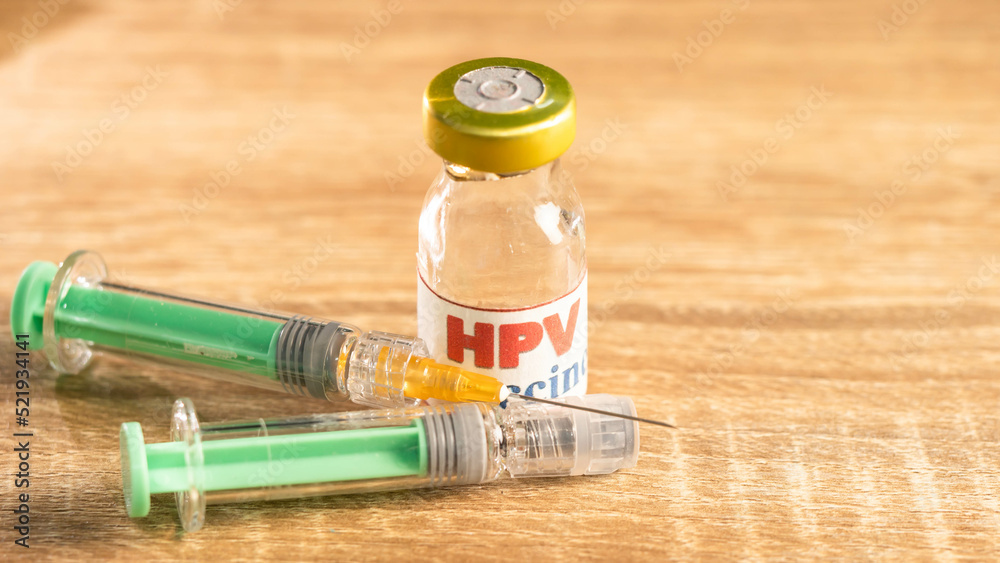 Injection needle with stethoscope and three bottles of vaccines " HPV ...