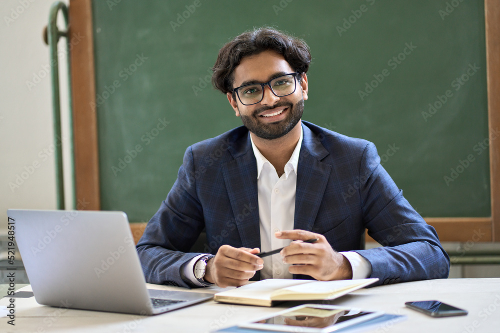 Happy young indian arabic businessman professional coach, teacher or ...