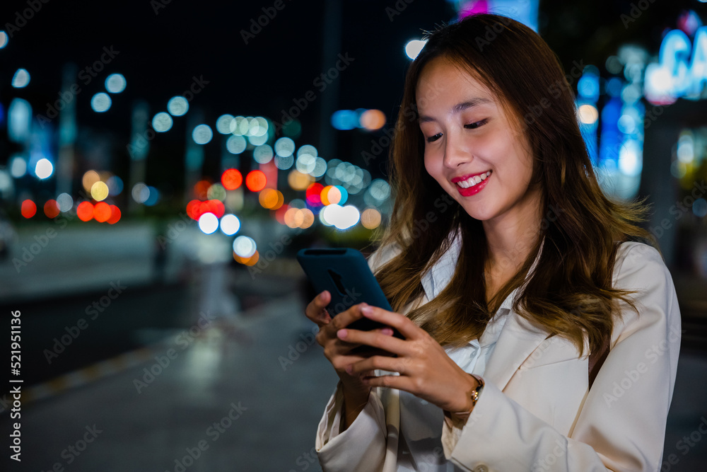 Beautiful young smiling female texting work message on smartphone ...