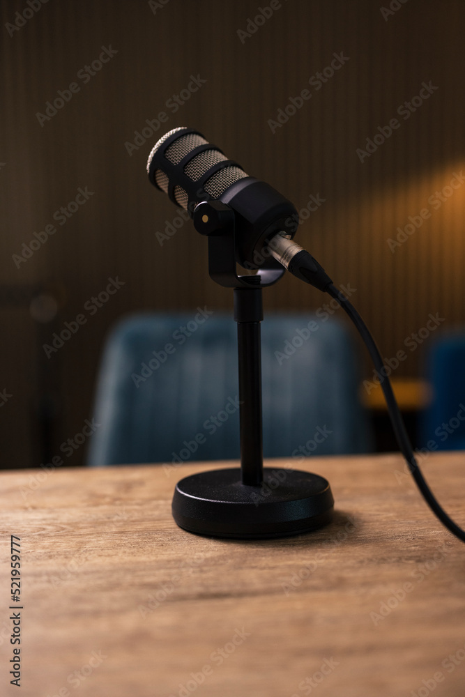 Microphone on desk in recording studio Stock Photo | Adobe Stock