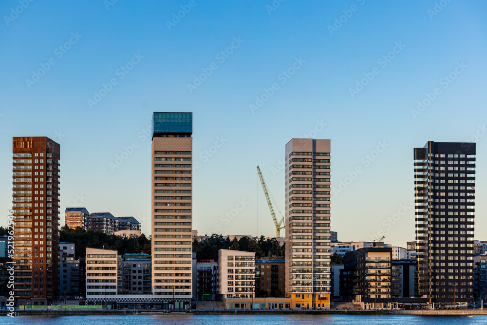 Stockholm, Sweden The sun rises over the Liljeholmskajen neighborhood ...