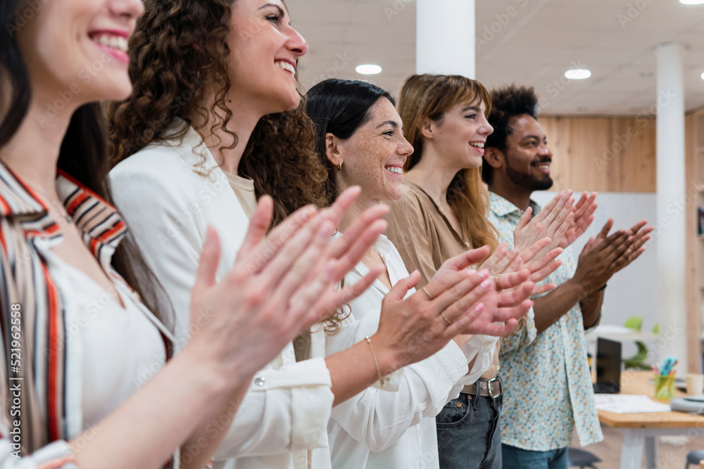 Happy business team clapping hands after a presentation in office Stock ...