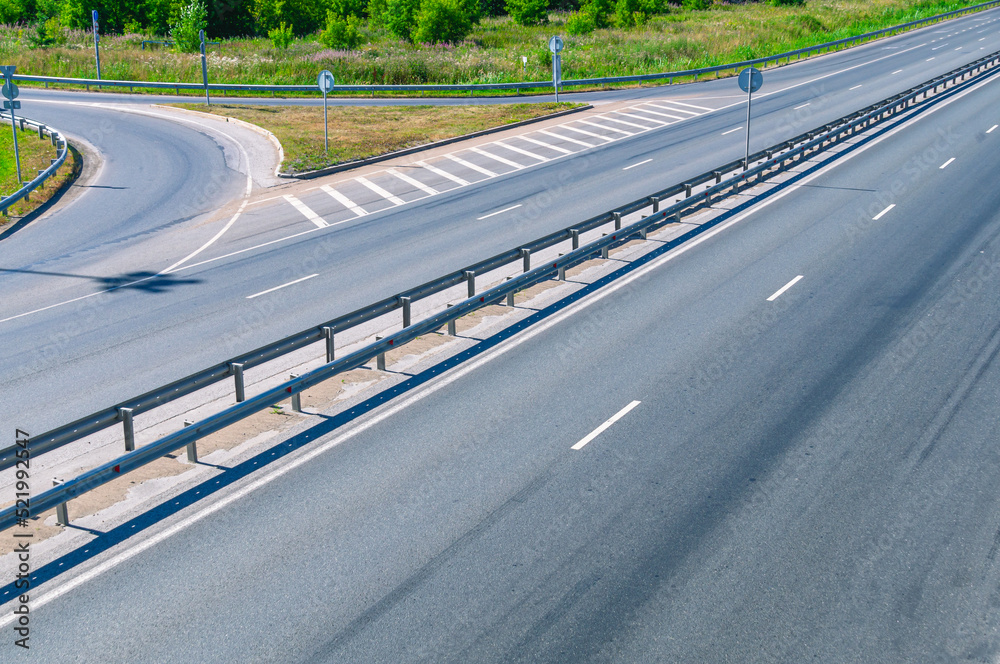 Highway with road signs. A road interchange to ensure safety when ...