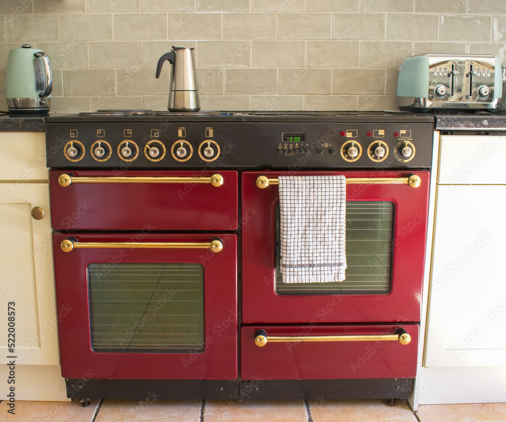 Red Range style stove cooker with a silver mocha coffee pot on a hot ...