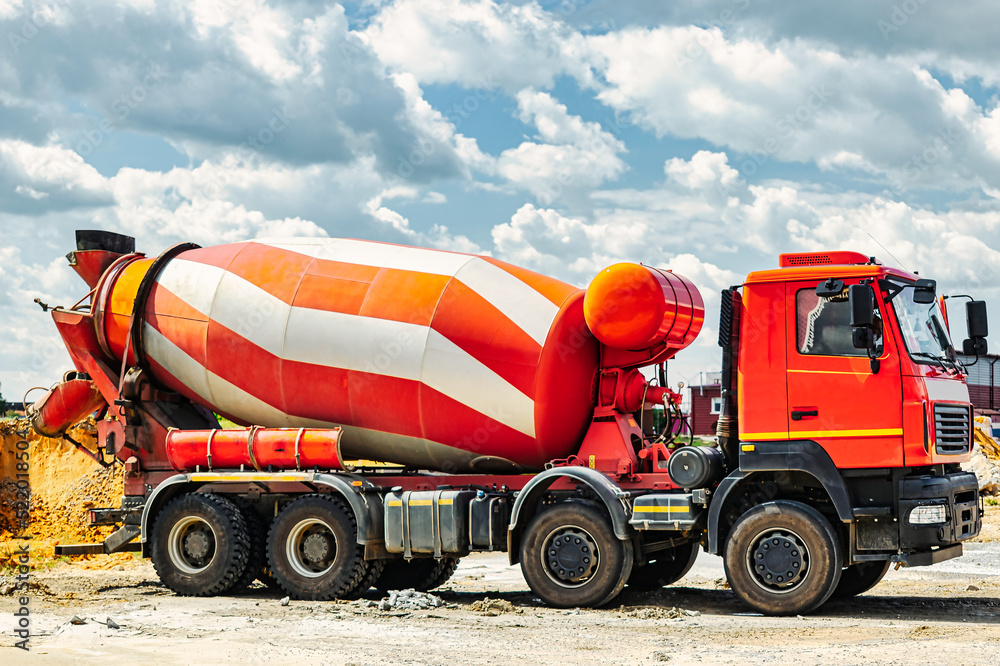 Concrete mixer truck in front of a concrete batching plant, cement ...