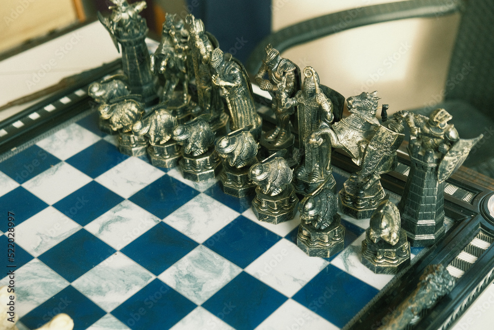 Old collectible chess board with beautiful and stylish chess pieces ...