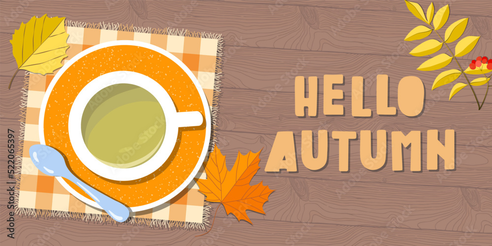 Tea cup and spoon on the wooden table. Hello autumn trendy top down ...