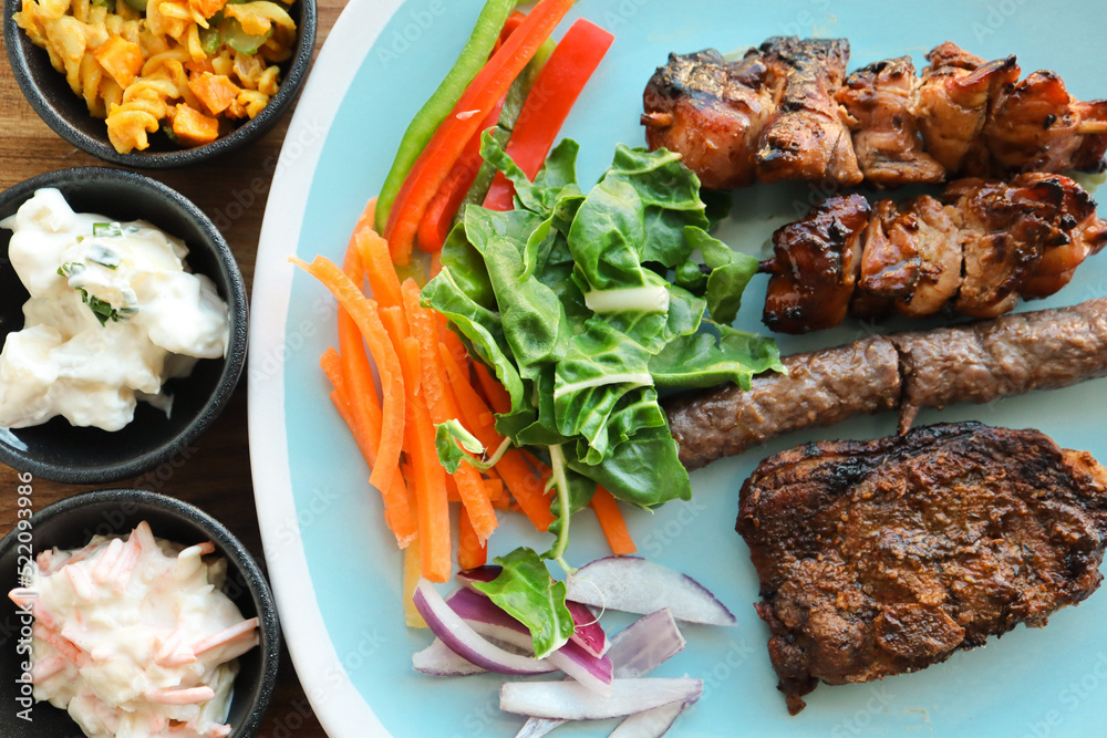 Plate of braaied meat. South African braai meat including boerewors ...