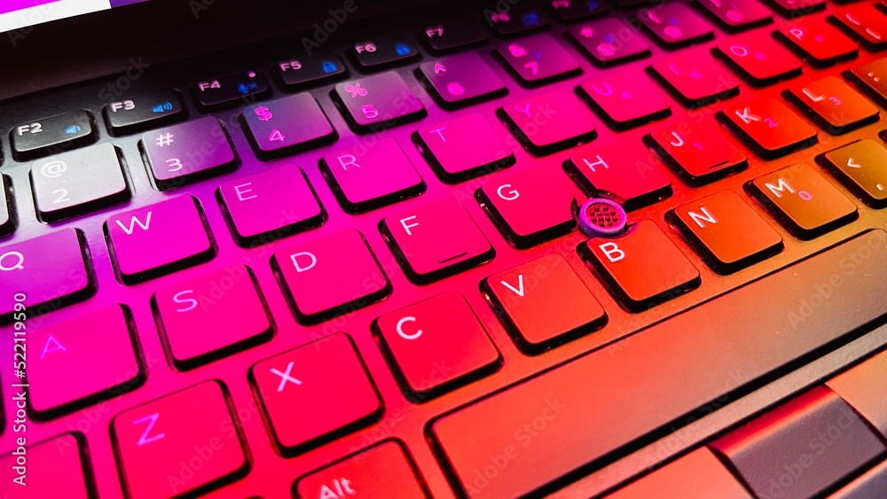 Studio shot of closeup of laptop keyboard illumination, backlit ...