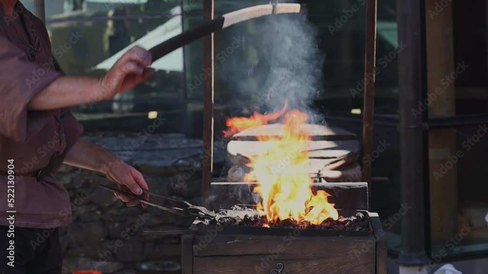 Vídeo do Stock: Middle aged caucasian male blacksmith of the medieval ...