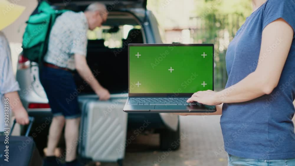 Woman having laptop with green screen chroma key background. Person ...