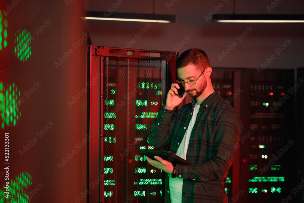 Programmer consulting with coworker about system failure Stock Photo ...