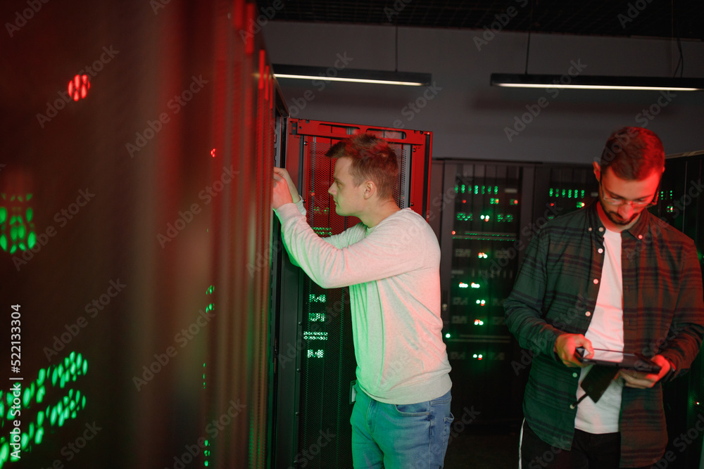 IT engineers solving system failures together Stock Photo | Adobe Stock