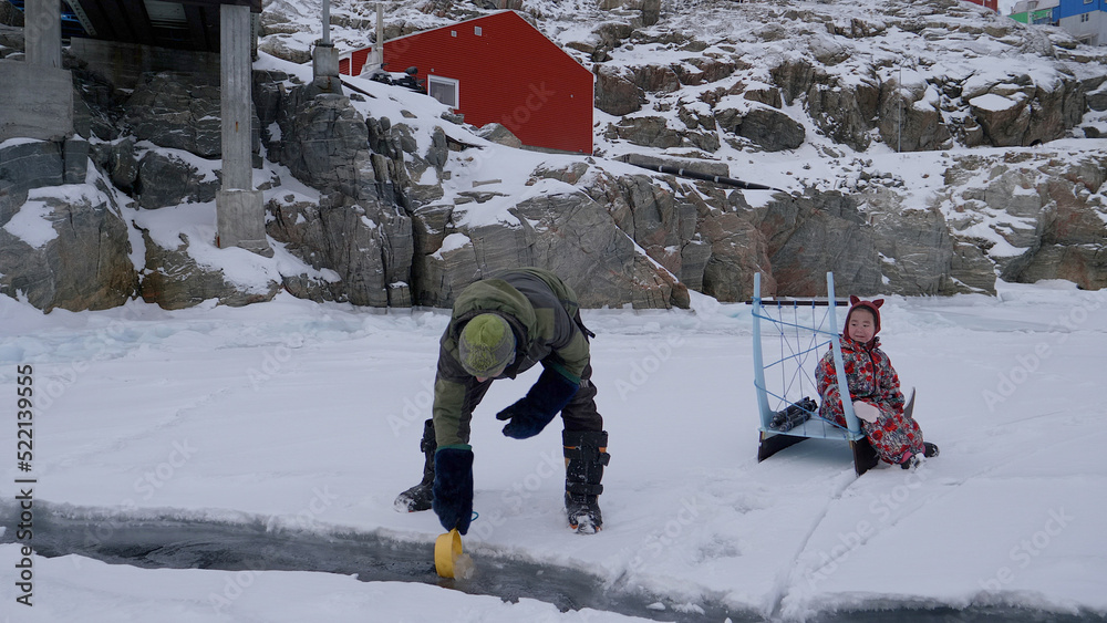 Arctic Greenland sea ice: authentic Inuit father & daughter, sled ride ...
