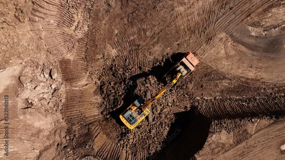 Excavator during clay mining. mining in open pit. Aerial view of an ...