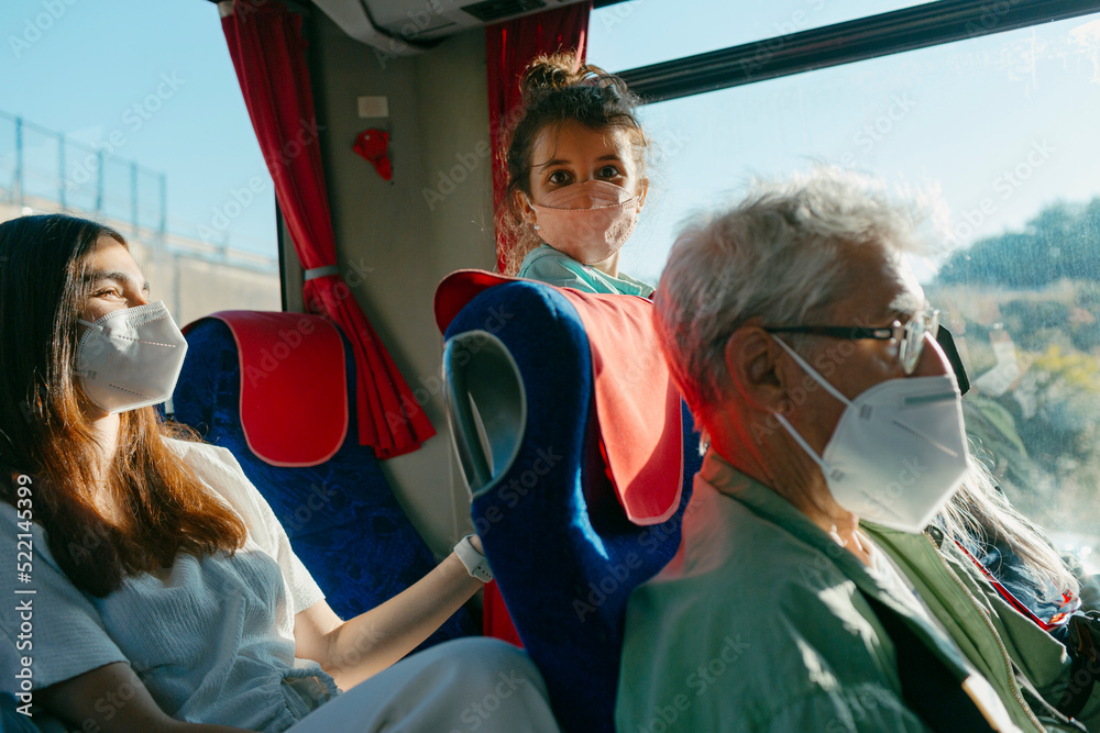 Intergenerational group of people traveling together on bus Stock Photo ...