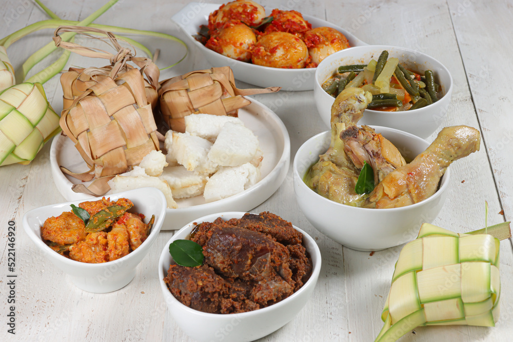 Ketupat Lebaran, served with sambal goreng, opor ayam, sayur labu siam ...