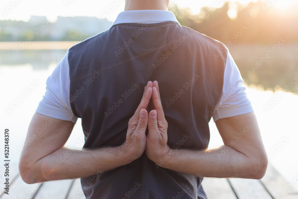namaste behind the back Stock Photo | Adobe Stock