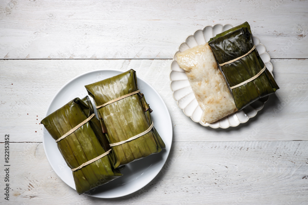 Buras or Burasa, is rice dumpling cooked in coconut milk wrapped in ...
