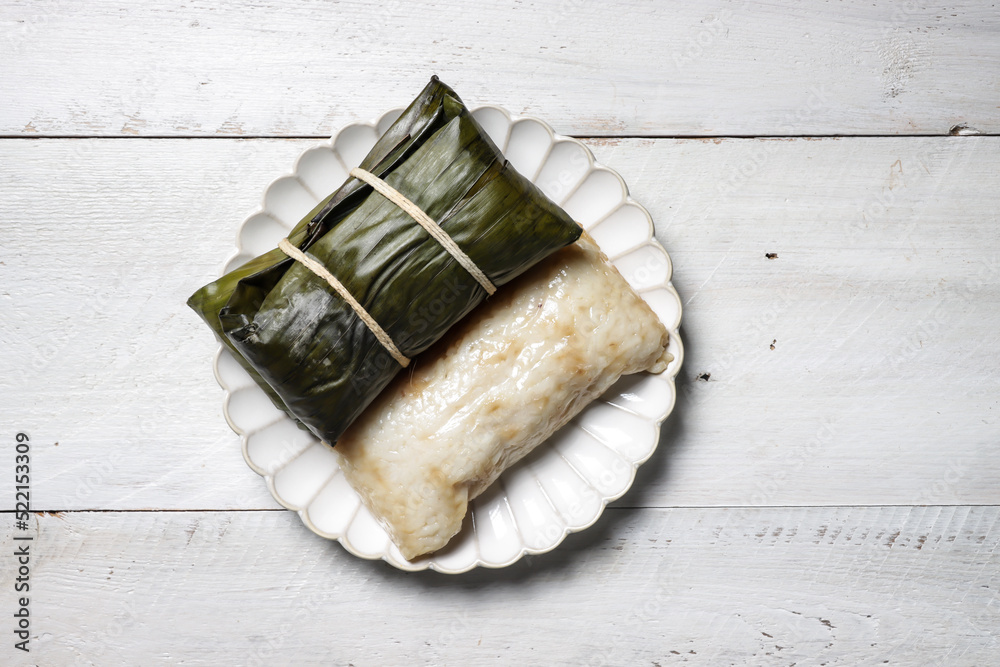 Buras or Burasa, is rice dumpling cooked in coconut milk wrapped in ...