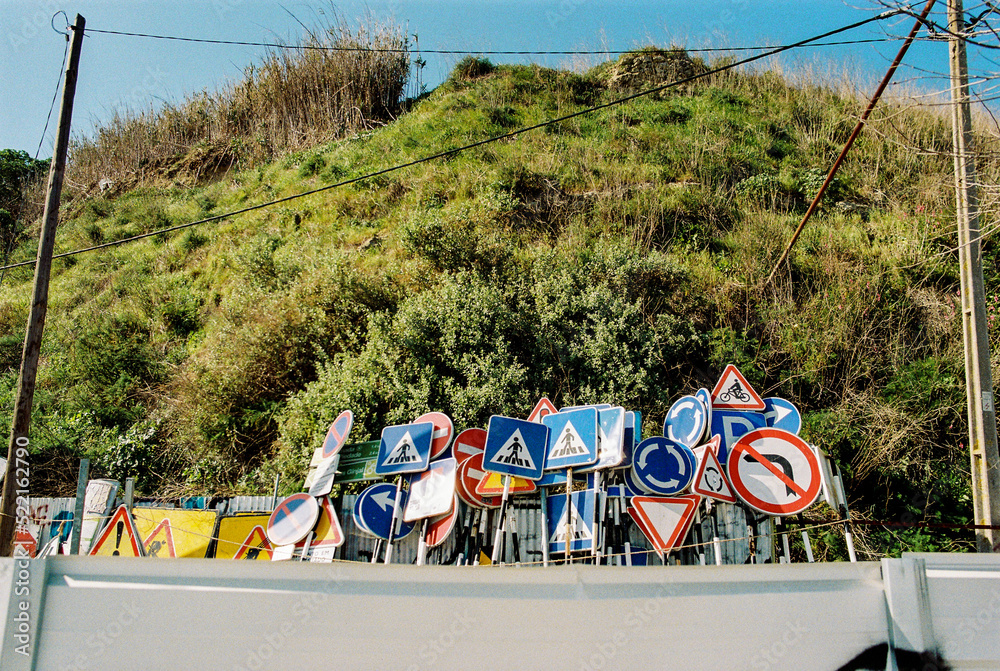 Traffic signs behind a fence Stock Photo | Adobe Stock