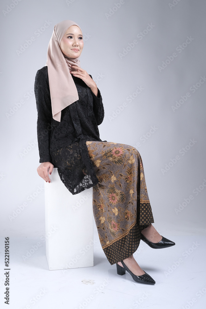 Portrait of a female wearing a hijab, a form of lifestyle garments for ...