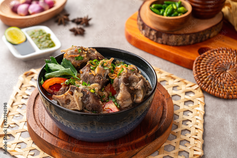 sop buntut or oxtail soup. Made from pieces of beef tail that are ...