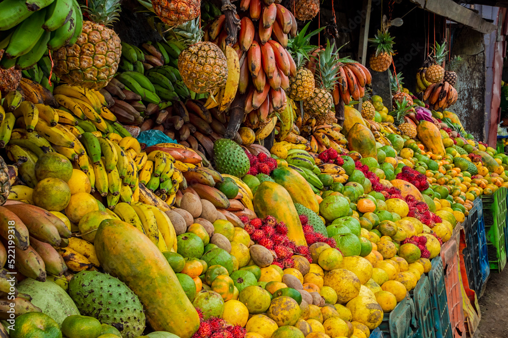 View of a traditional fruit stall. Shelf with variety of fresh fruits ...
