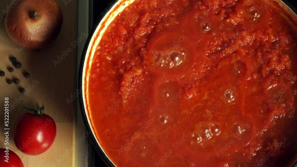 Close up of top view of boiling tomato Italian sauce for pasta or pizza ...
