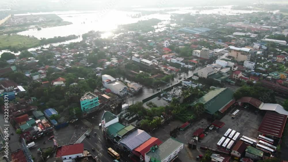 Drone aerial rotating view showing the cityscape and some submerged ...